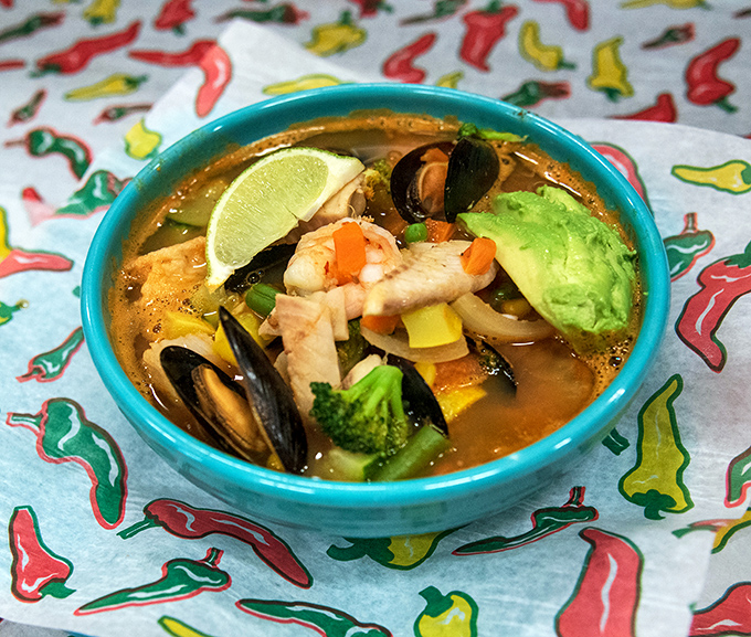 This seafood soup is like an ocean vacation in a bowl. Fresh mussels, shrimp, and vegetables swim in a broth that's worth the trip alone.