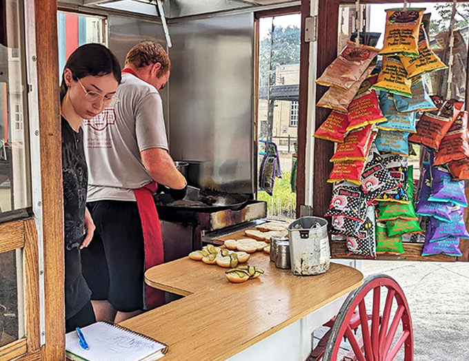 The sacred art of burger preparation requires focus, precision, and respect for tradition. Like watching artisans craft a masterpiece, but edible.