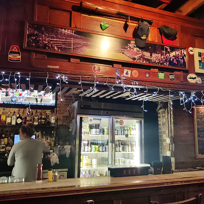 Behind every great bar is a team that makes the magic happen. The wood paneling and sports memorabilia create that perfect neighborhood vibe.