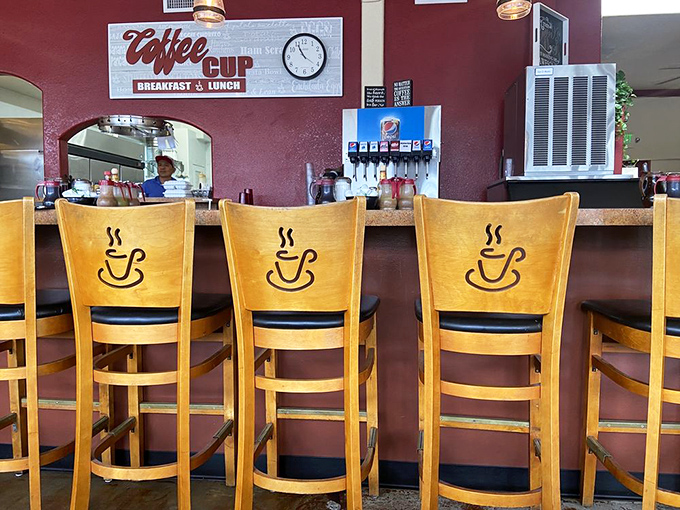 Wooden chairs with coffee cup cutouts tell you everything: this place takes its namesake seriously. The counter seats&mdash;always the choice of breakfast connoisseurs.