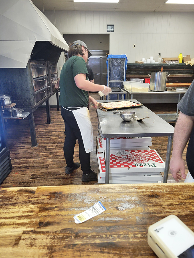 Behind the scenes where the magic happens &ndash; skilled hands preparing the next batch of rectangular perfection on well-worn wooden floors.