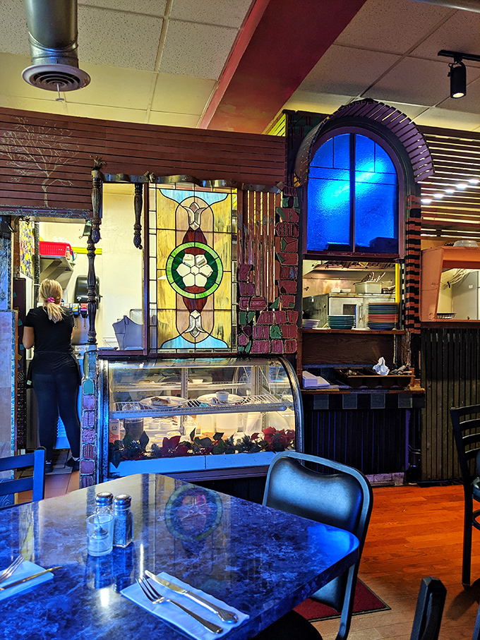 The interior's exposed ductwork and colorful design elements create an atmosphere that's equal parts industrial chic and artistic whimsy&mdash;just like the food. 