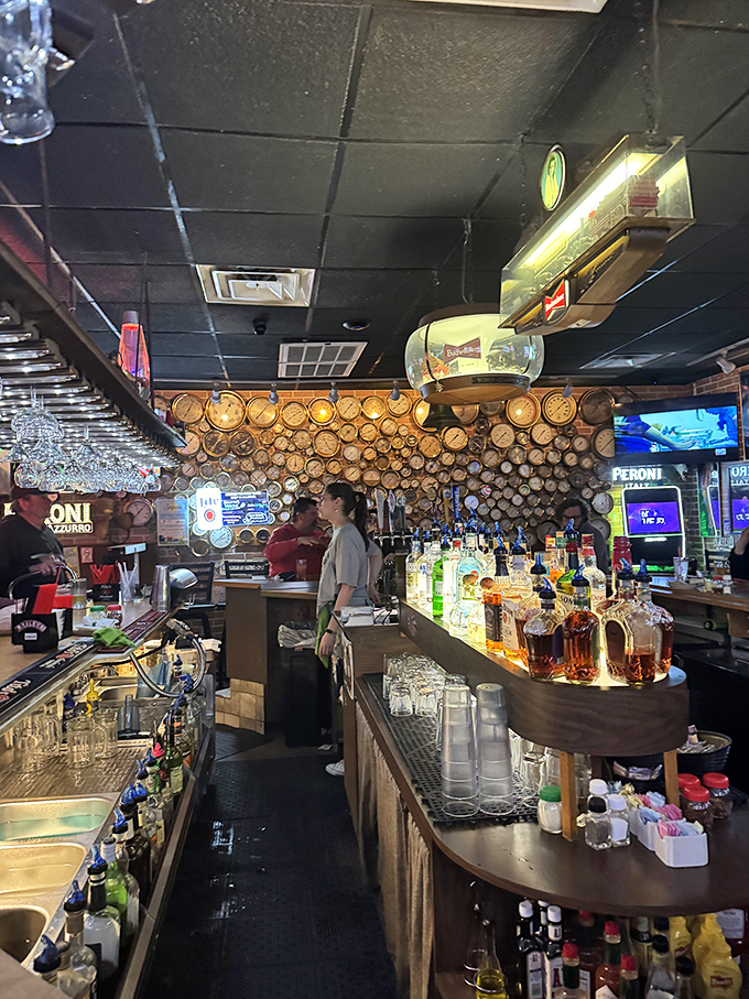 The bar area, where vintage clocks meet modern spirits. This isn't just where drinks are served&mdash;it's where strangers become friends over shared stories and Limoncello.