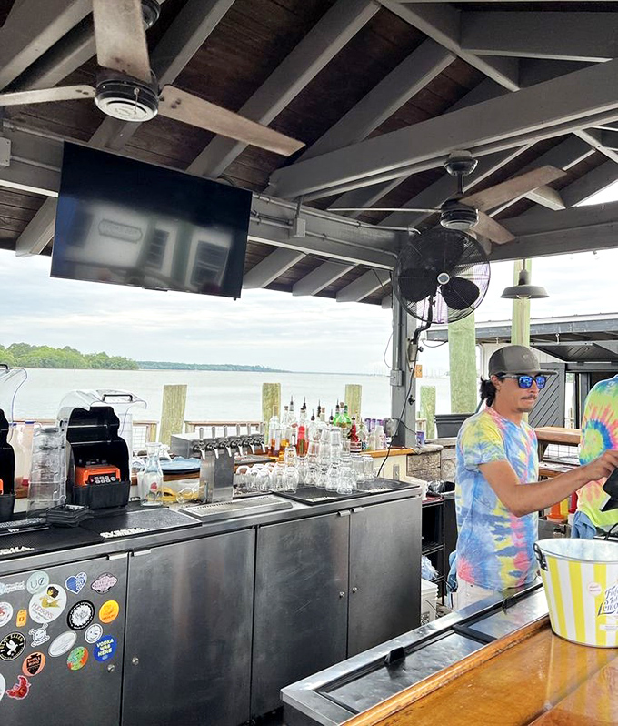 Where the magic happens &ndash; an outdoor bar with water views that could make any cocktail taste better. The tie-dye shirt is just a bonus.