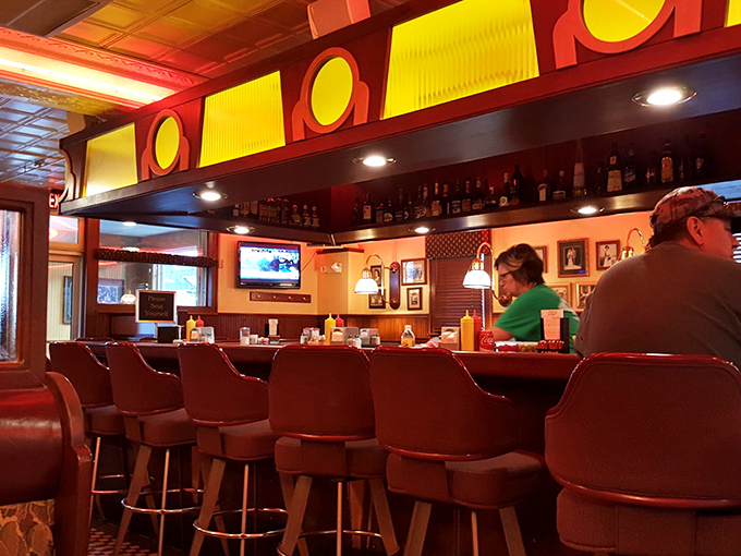 The warm glow of the bar invites conversation, while the lineup of bottles promises to make those conversations increasingly interesting.