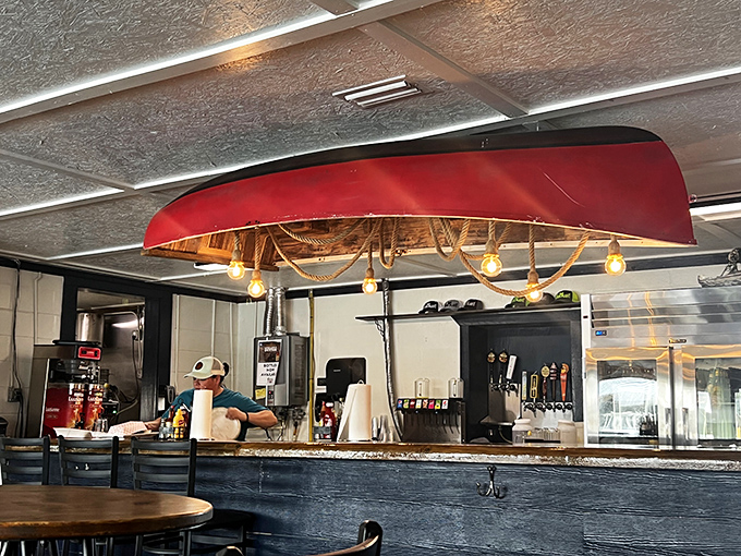 Behind the counter, where the magic happens. That red canoe hanging from the ceiling isn't just d&eacute;cor&mdash;it's a nod to the waters that provide the restaurant's treasures.