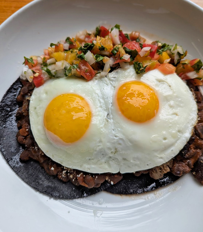 Two sunny-side eggs staring back at you from atop a bed of beans&mdash;like breakfast's version of the Mona Lisa, their gaze follows you around the room.