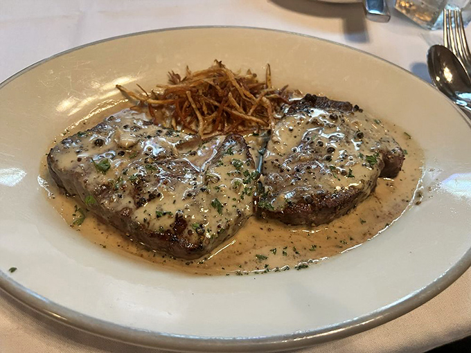 Steak au poivre that's not just dinner but a declaration of love—peppercorns and cream sauce creating a French masterpiece in Ohio.
