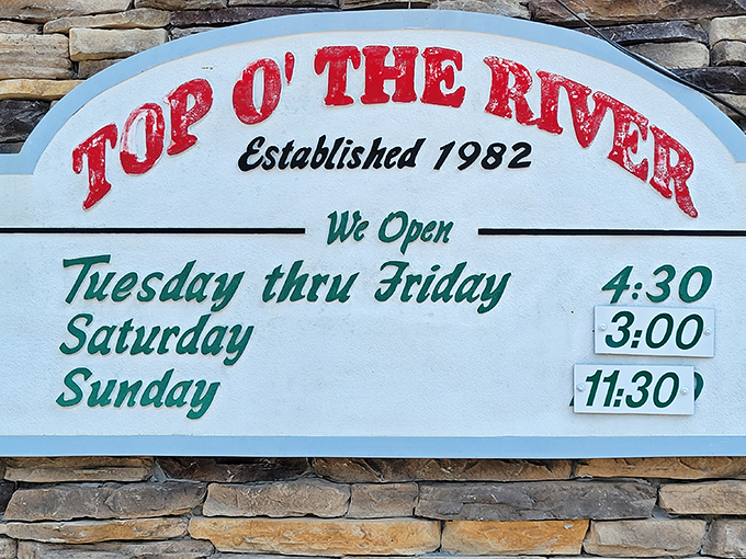 Operating hours posted on stone&mdash;as solid and dependable as the restaurant itself. Mark your calendar accordingly; catfish cravings wait for no one.