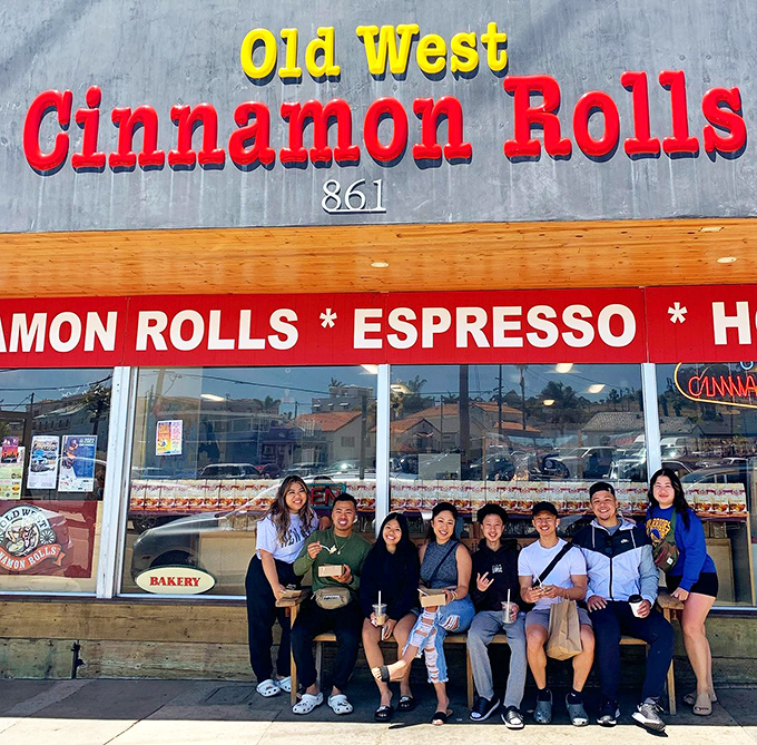 Pilgrimage complete! These happy visitors know that some memories are best measured in calories and smiles.