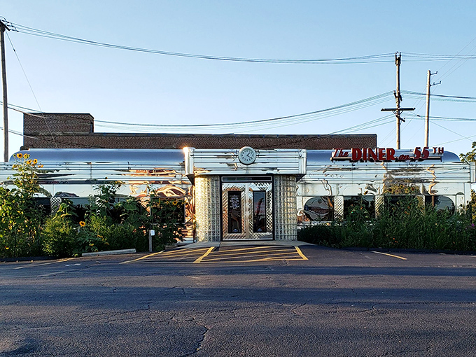 As dusk settles, the illuminated Diner on 55th sign glows like a beacon of hope for the hungry, promising that tomorrow's breakfast will be worth getting out of bed for.