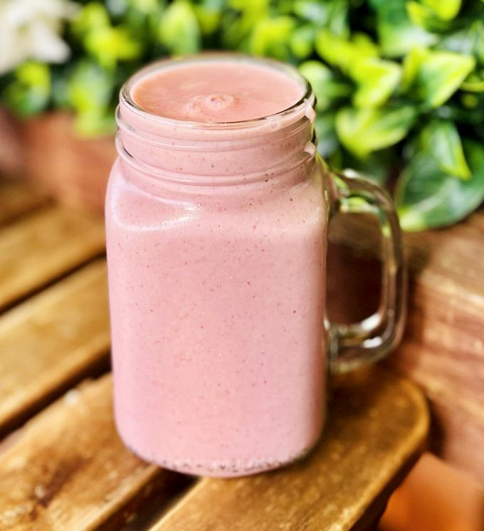 A strawberry protein shake that doesn't taste like punishment. This mason jar of pink possibility actually delivers on both flavor and function.