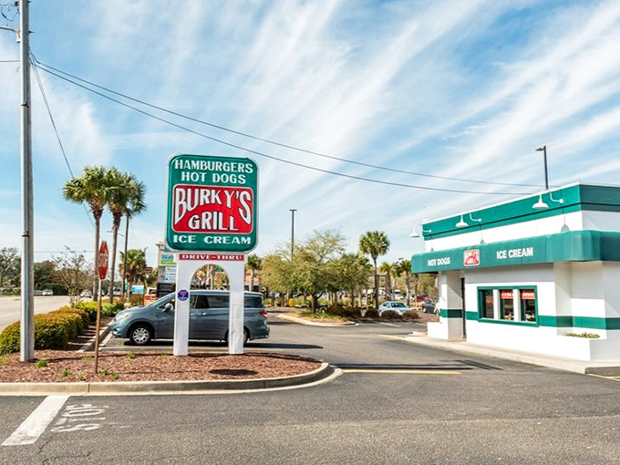 The roadside sign stands tall among palm trees, a siren call to those wise enough to venture beyond the beachfront tourist spots.