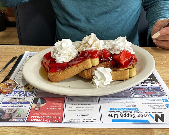 French toast that's had a glow-up &ndash; stuffed with goodness, crowned with strawberries and whipped cream, it's breakfast masquerading as dessert.