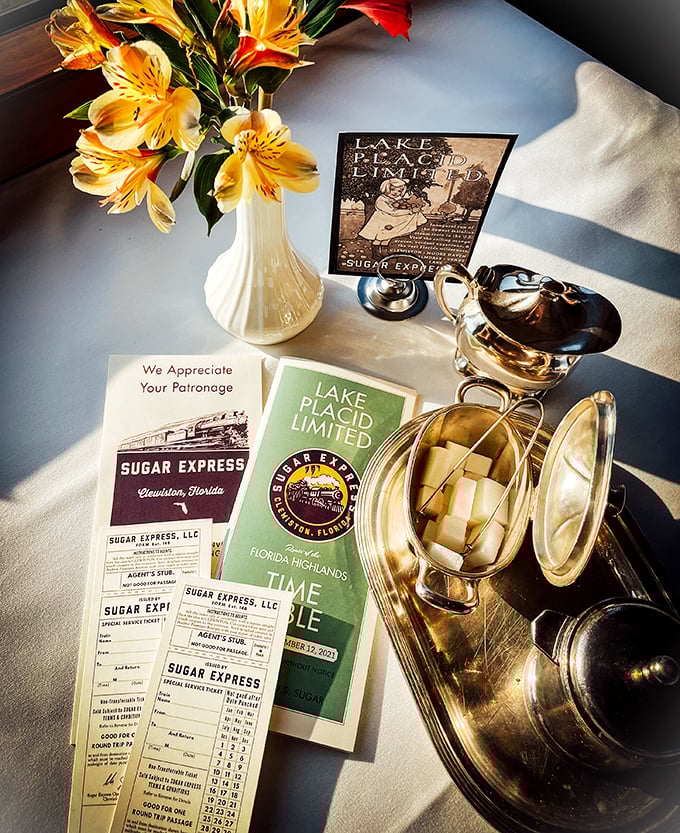 Elegant table settings and commemorative tickets create moments of refinement amid the journey. Don't forget the sugar for your tea!