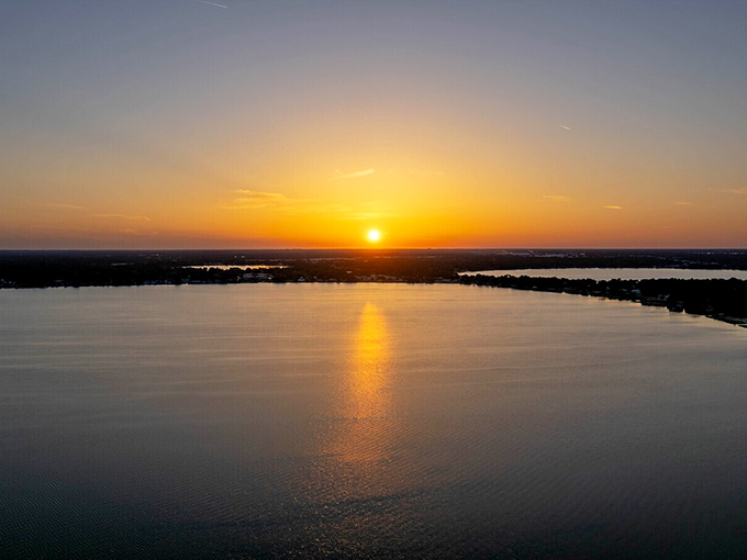 Sunsets over Winter Haven's lakes deliver the kind of daily show that coastal residents pay triple the mortgage to witness.