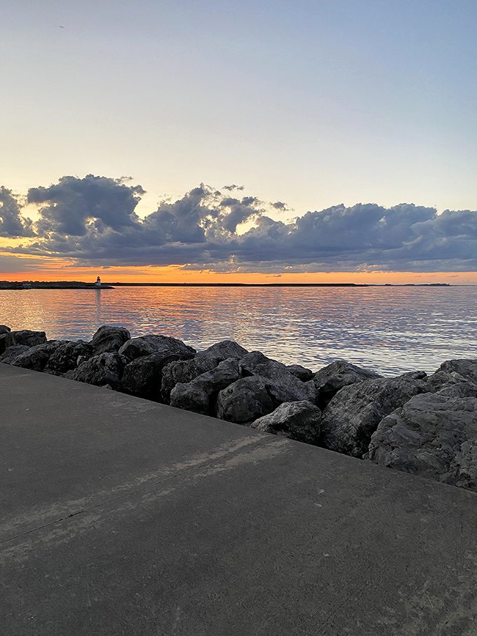 Sunset transforms the ordinary into extraordinary, as Erie's waters reflect the day's final light show in a mirror-perfect farewell performance.