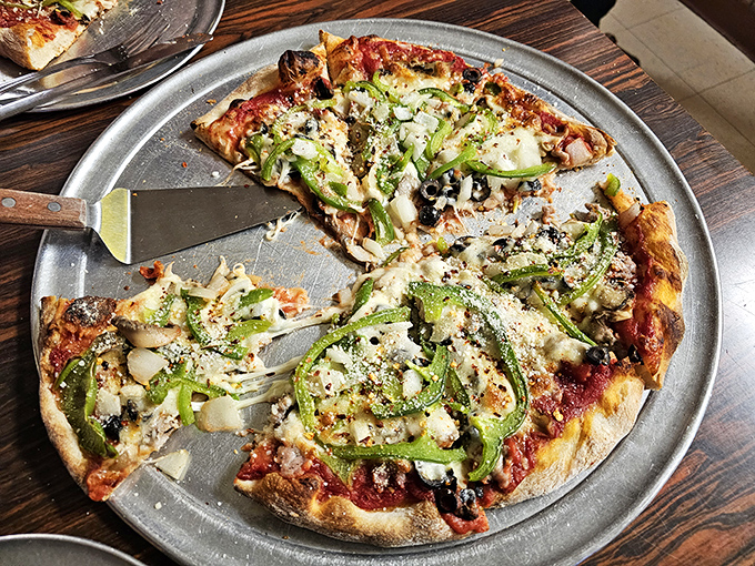 A supreme pizza that actually deserves the name&mdash;each topping placed with purpose, the green peppers curling slightly at the edges from the heat.