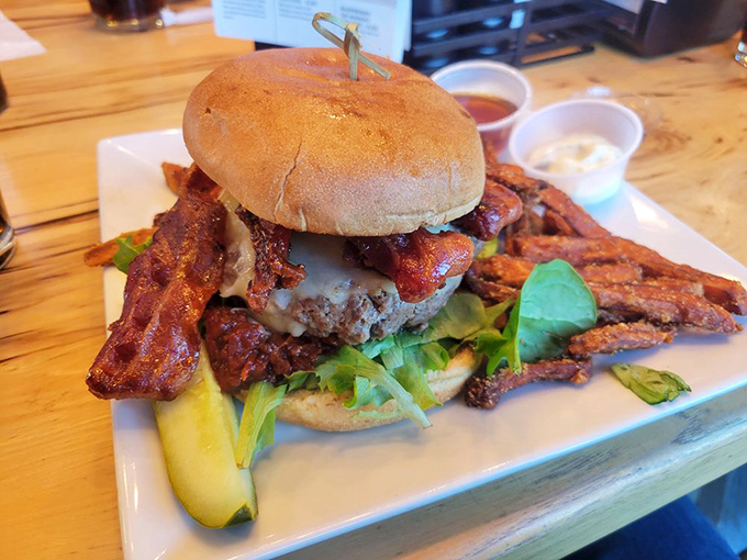 This isn't just a burger&mdash;it's a towering achievement in beef architecture, complete with bacon reinforcements and sweet potato sidekicks.