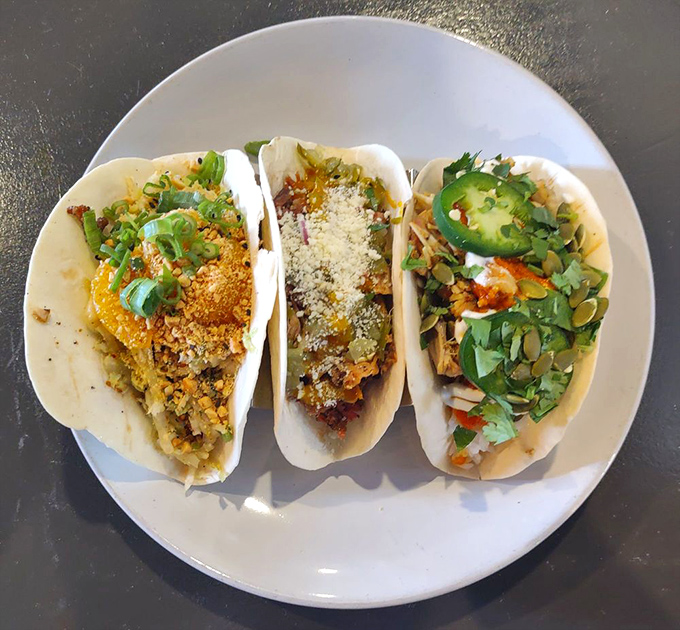 A trio of tacos that tells three different delicious stories. Each one is a perfect little handheld vacation to flavor town.