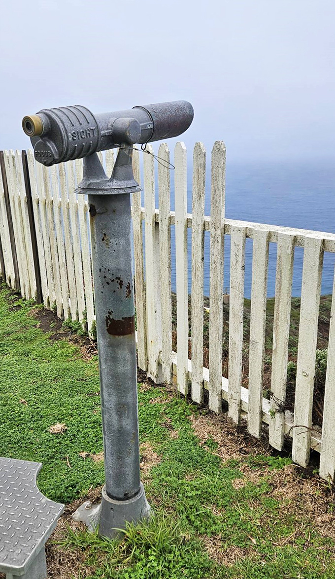 The vintage telescope stands ready for visitors to spot whales, ships, or perhaps scan the horizon for incoming fog&mdash;a lighthouse keeper's nemesis.