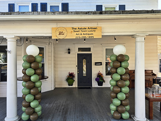 The Astute Artisan welcomes visitors with earth-toned balloon columns that say, "Yes, we take our crafts seriously, but not ourselves."