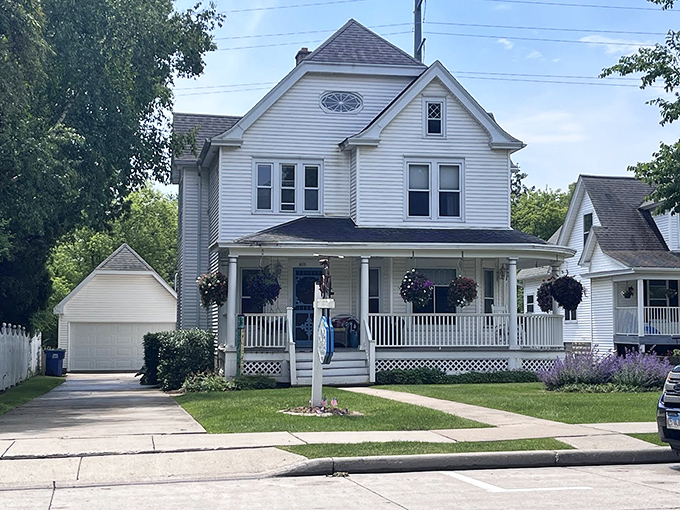 This picture-perfect Victorian home with its welcoming porch and hanging baskets embodies Midwest charm. The purple lavender adds just the right touch of color – like nature's own welcome mat.