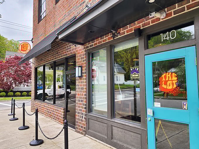 The Lot Beer Co.'s turquoise door pops against brick walls, signaling that something refreshingly different awaits inside this craft brewery.