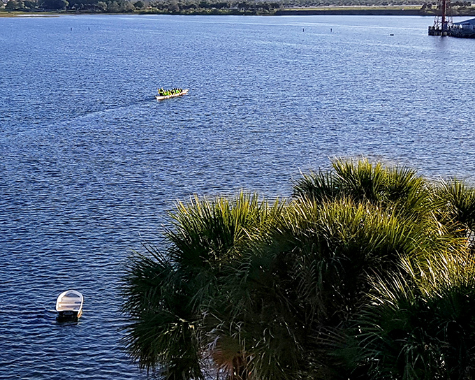 Reflections dance across calm waters as residents enjoy the boardwalk&mdash;a daily ritual that never loses its charm in this waterfront community.