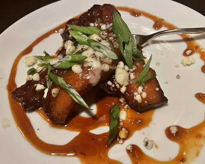 Thick-cut bacon glazed to mahogany perfection &ndash; proof that sometimes the appetizer can be just as memorable as the main course.