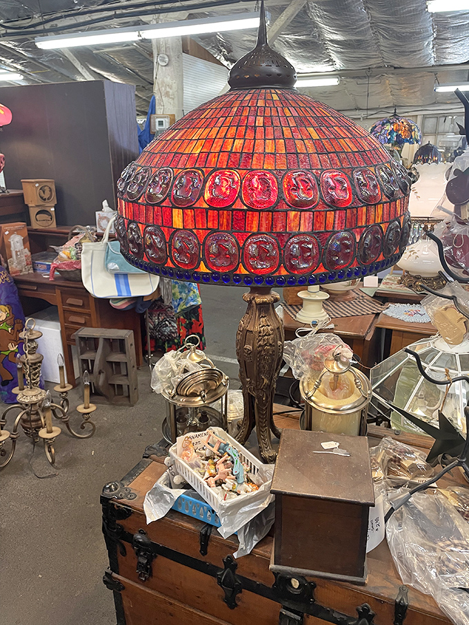 This Tiffany-style lamp glows like a sunset among the antique treasures. One person's attic castoff becomes another's conversation-starting masterpiece.