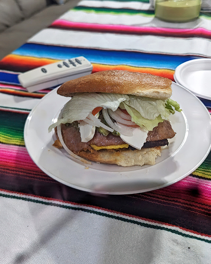 This torta asada isn't just a sandwich&mdash;it's an engineering marvel of textures and flavors stacked between bread that knows its purpose.
