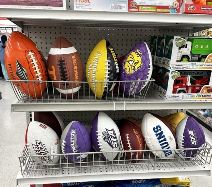 Sports fans rejoice! Team spirit doesn't have to break the bank when footballs representing every allegiance huddle together on these shelves.