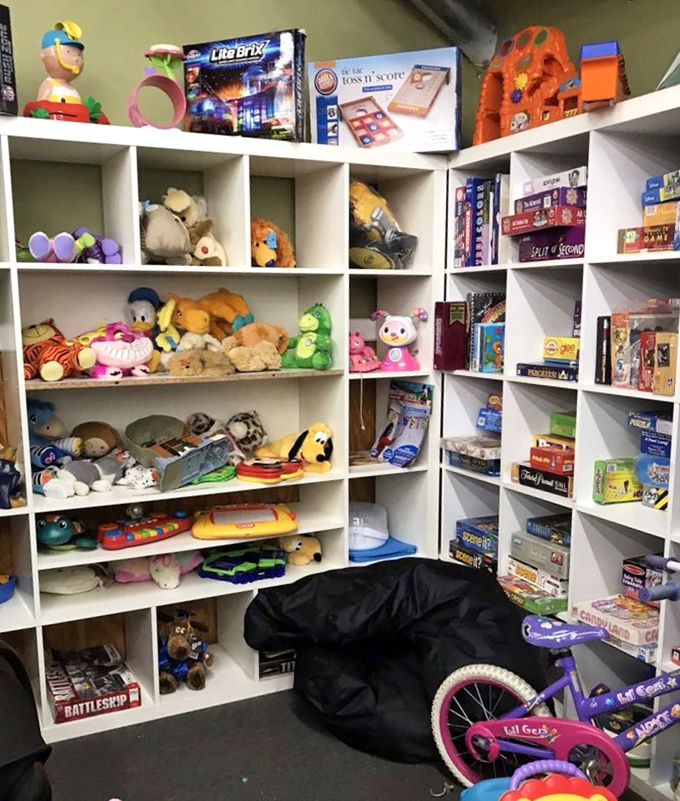 The toy corner—where nostalgic board games and stuffed friends await adoption into homes where screens haven't completely taken over.