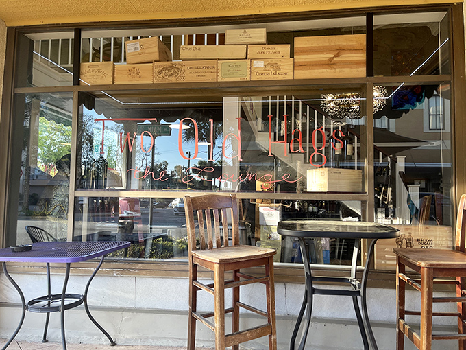 Two Old Hags Wine Shoppe offers sidewalk seating perfect for people-watching while sipping something that doesn't require a financial advisor's approval.