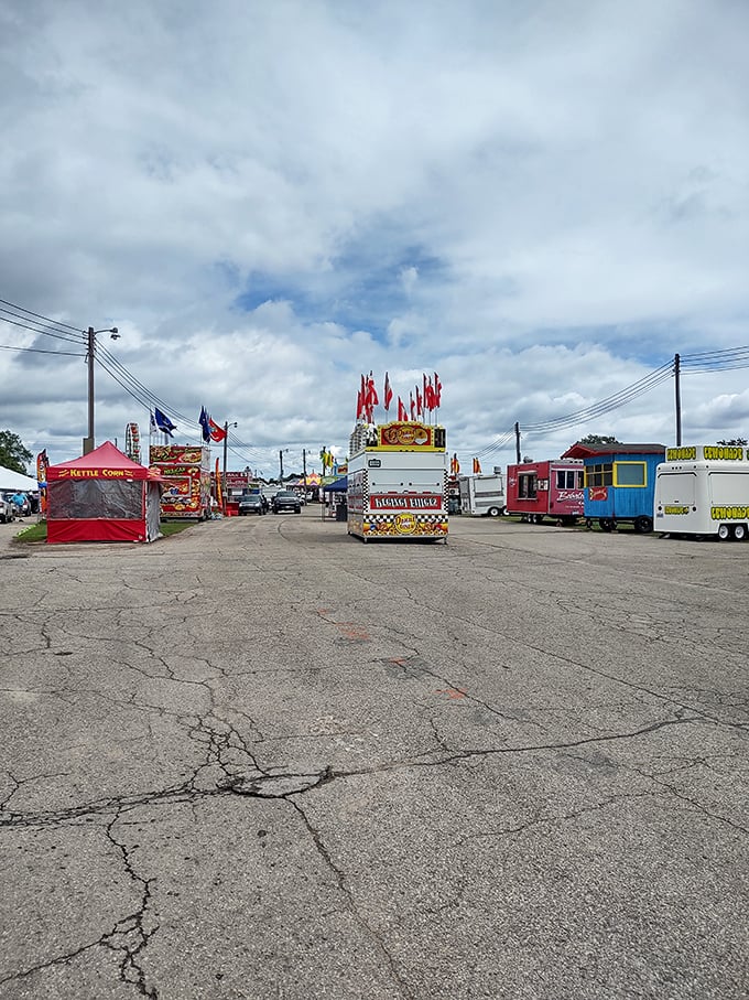 Carnival food vendors line up at the U.P. State Fair, creating that irresistible aroma of fried dough that somehow smells exactly like summer memories.
