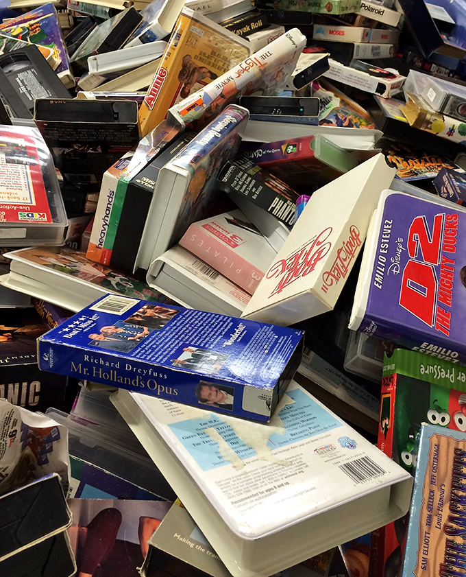 Media archeology at its finest—these VHS relics and DVDs contain forgotten cinematic treasures waiting for their renaissance.