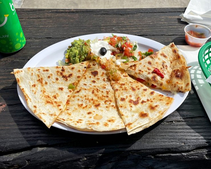 A quesadilla that achieves the golden ratio of crispy exterior to molten interior—the kind that makes you wonder why you ever order anything else.