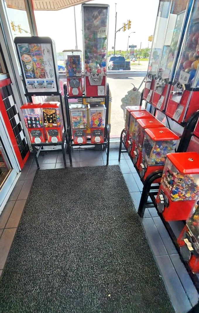 The entrance candy machines stand like colorful sentinels, promising a sweet ending before your meal even begins.
