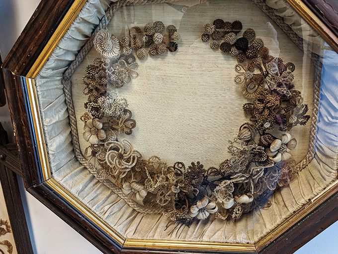 This octagonal framed wreath showcases the incredible artistry possible with human hair. Victorian crafters were the original upcyclers!