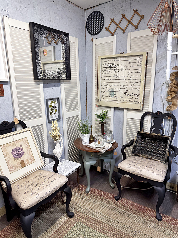 A perfectly staged sitting area where vintage chairs with script upholstery invite you to pause and imagine conversations from another era.