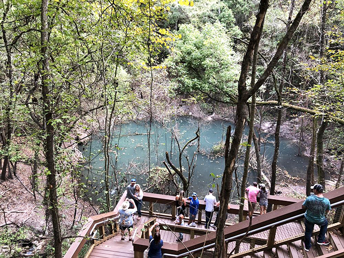 Visitors gather at the observation deck, collectively wondering if their phone cameras can possibly capture the surreal beauty below.