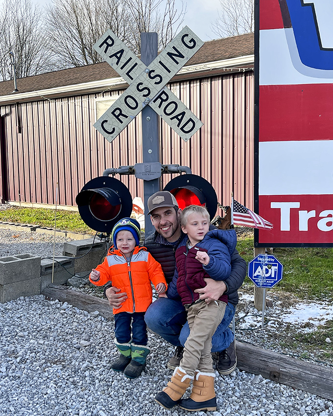Do Not Lean On Glass signs protect these miniature metropolises from curious giants. The cityscape draws visitors of all ages into its tiny reality.