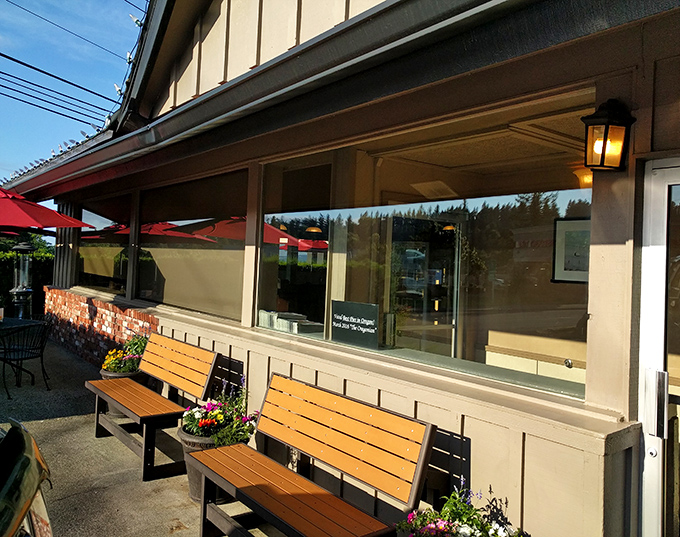 Wooden benches outside invite you to pause before entering or linger after your meal, soaking in that fresh Oregon air.