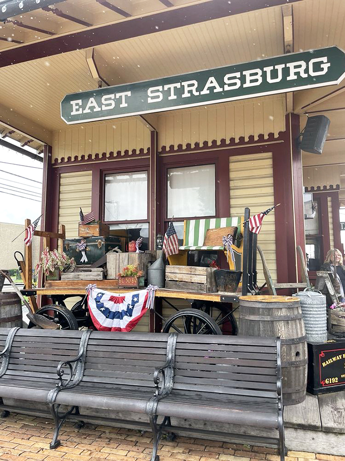 The East Strasburg waiting area, adorned with Americana, where modern travelers pause before stepping back into railroad's golden age.