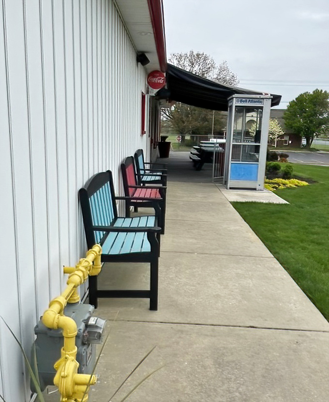 Even the waiting area channels mid-century charm with its phone booth and teal benches&mdash;making the anticipation part of the experience.