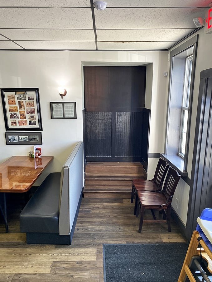 The entrance area's wooden divider and bench seating create a Tetris-like efficiency for hungry patrons waiting their turn.