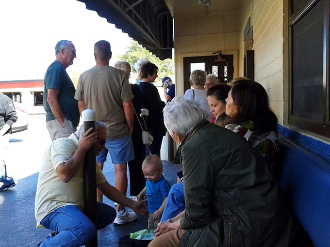 The waiting area where strangers become friends united by hunger and anticipation for what's coming.
