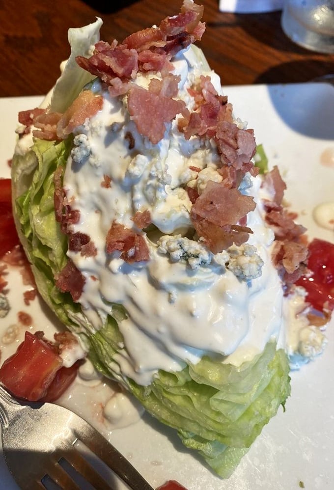 The wedge salad &ndash; America's brilliant solution to eating iceberg lettuce by smothering it with blue cheese and bacon. Democracy works!