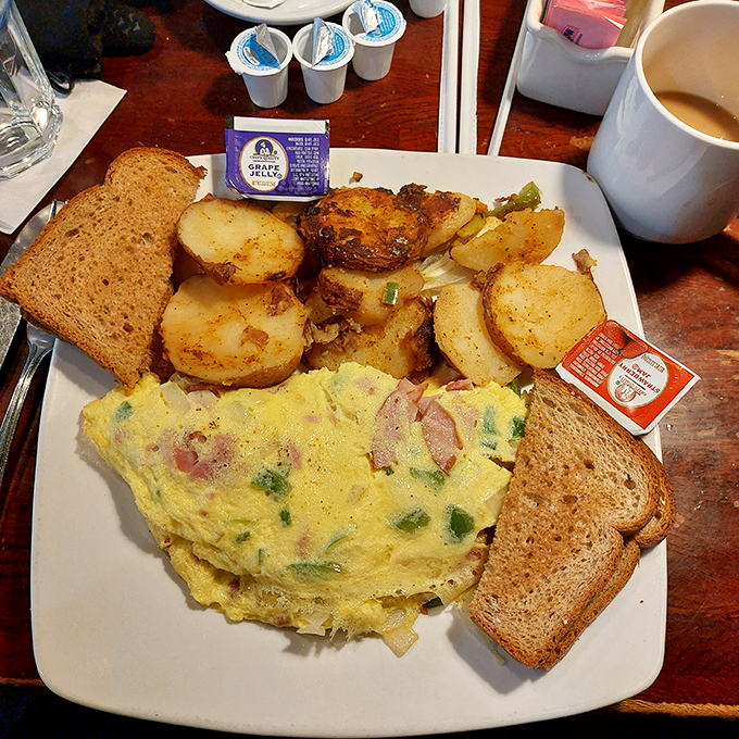 This Western omelet doesn't just contain ham and peppers&mdash;it showcases them in a fluffy egg embrace that makes mornings worth facing.